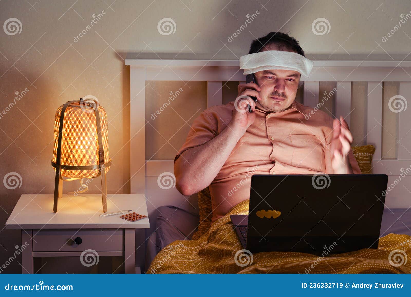 Adult Sick Man Talking on the Phone while Lying on Bed with Computer ...