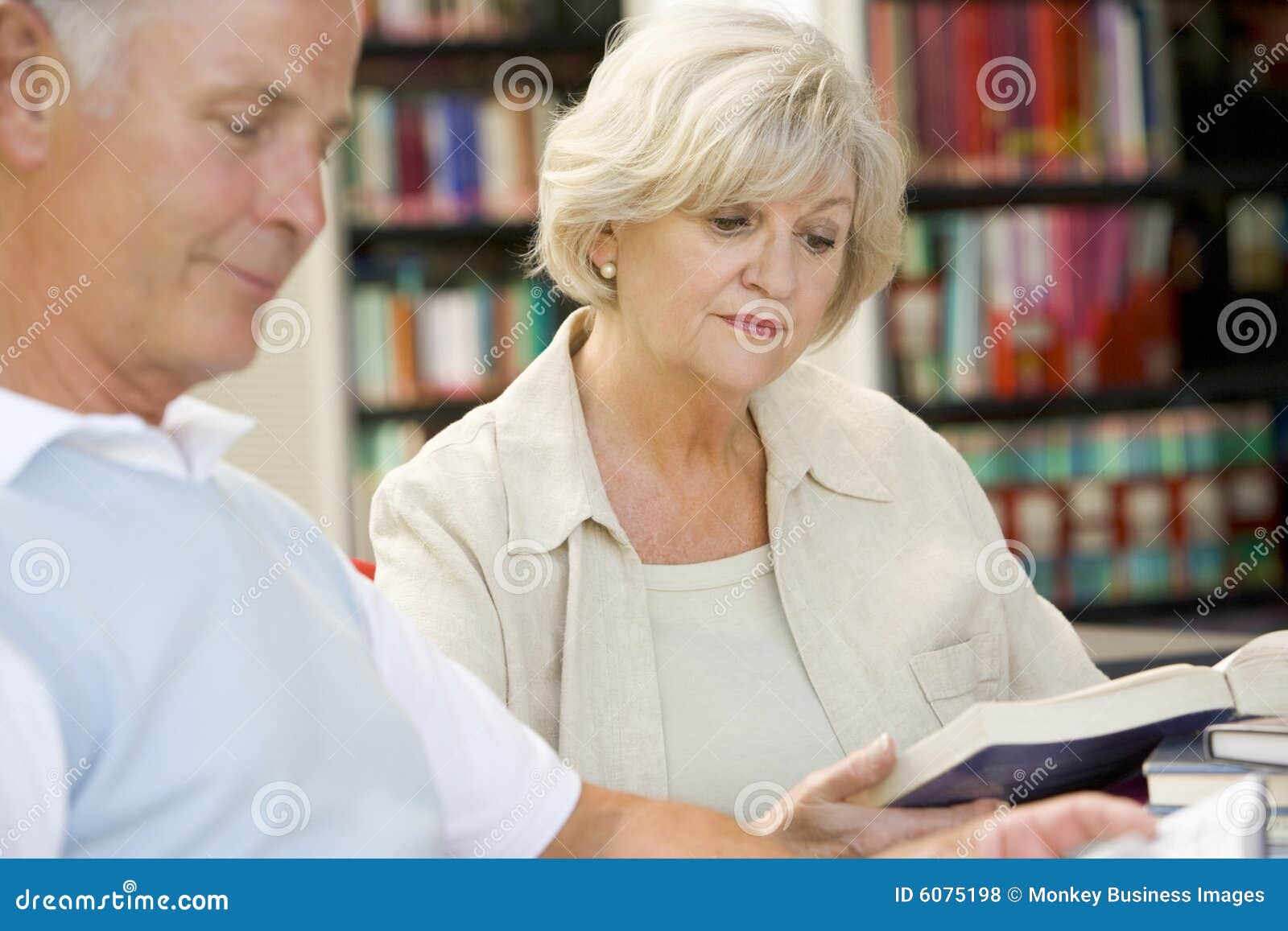 Adult Students Reading in a Library Stock Photo - Image of book ...