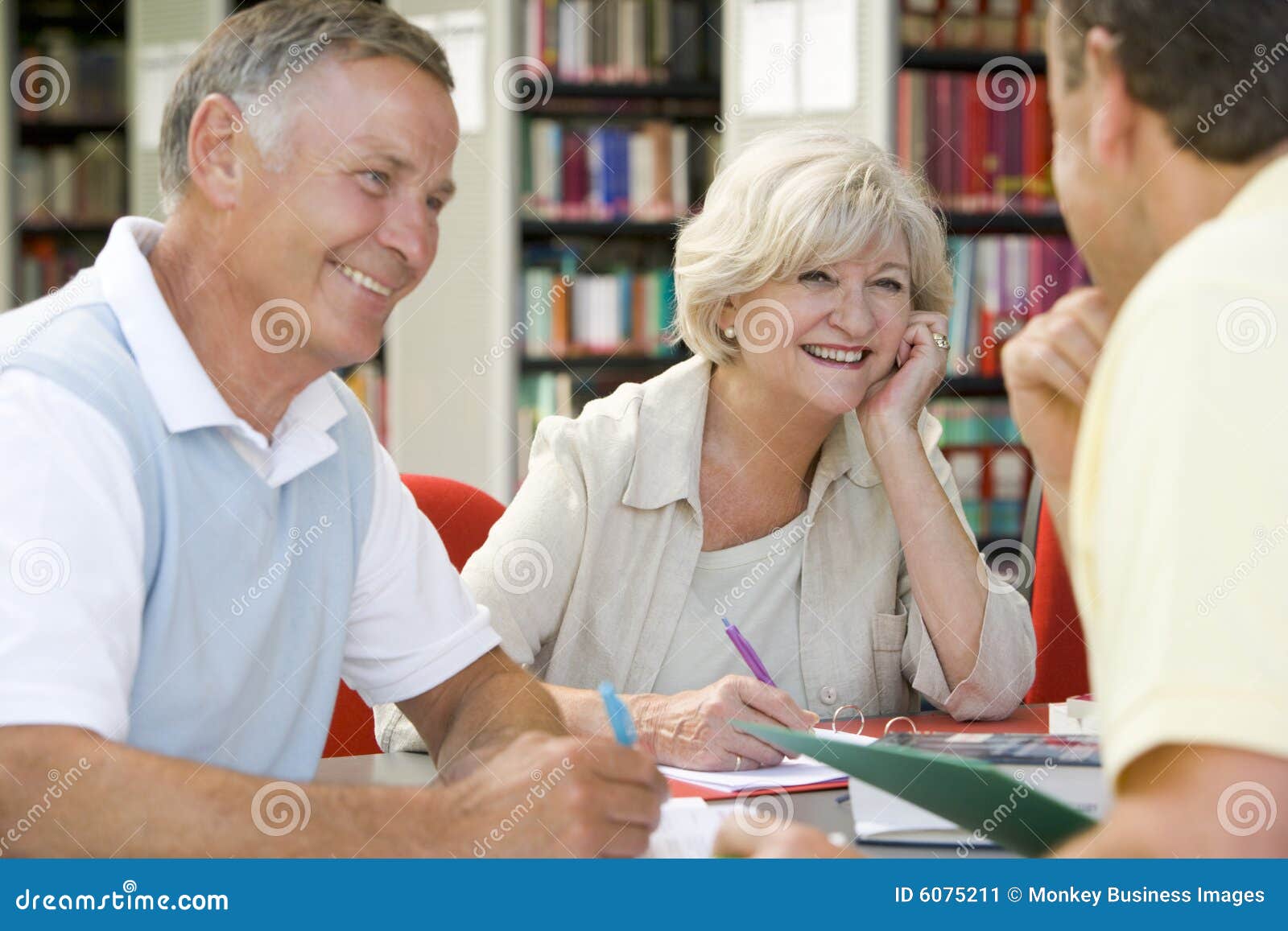 Adult Students Working Together in a Library Stock Image - Image of ...