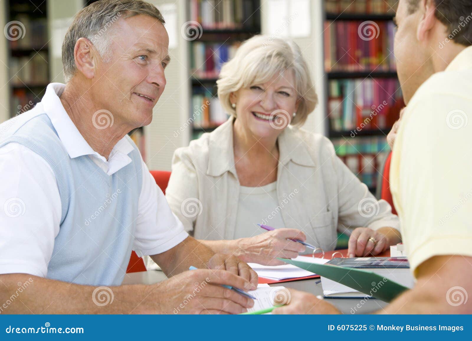 Adult Students Working Together in a Library Stock Image - Image of ...