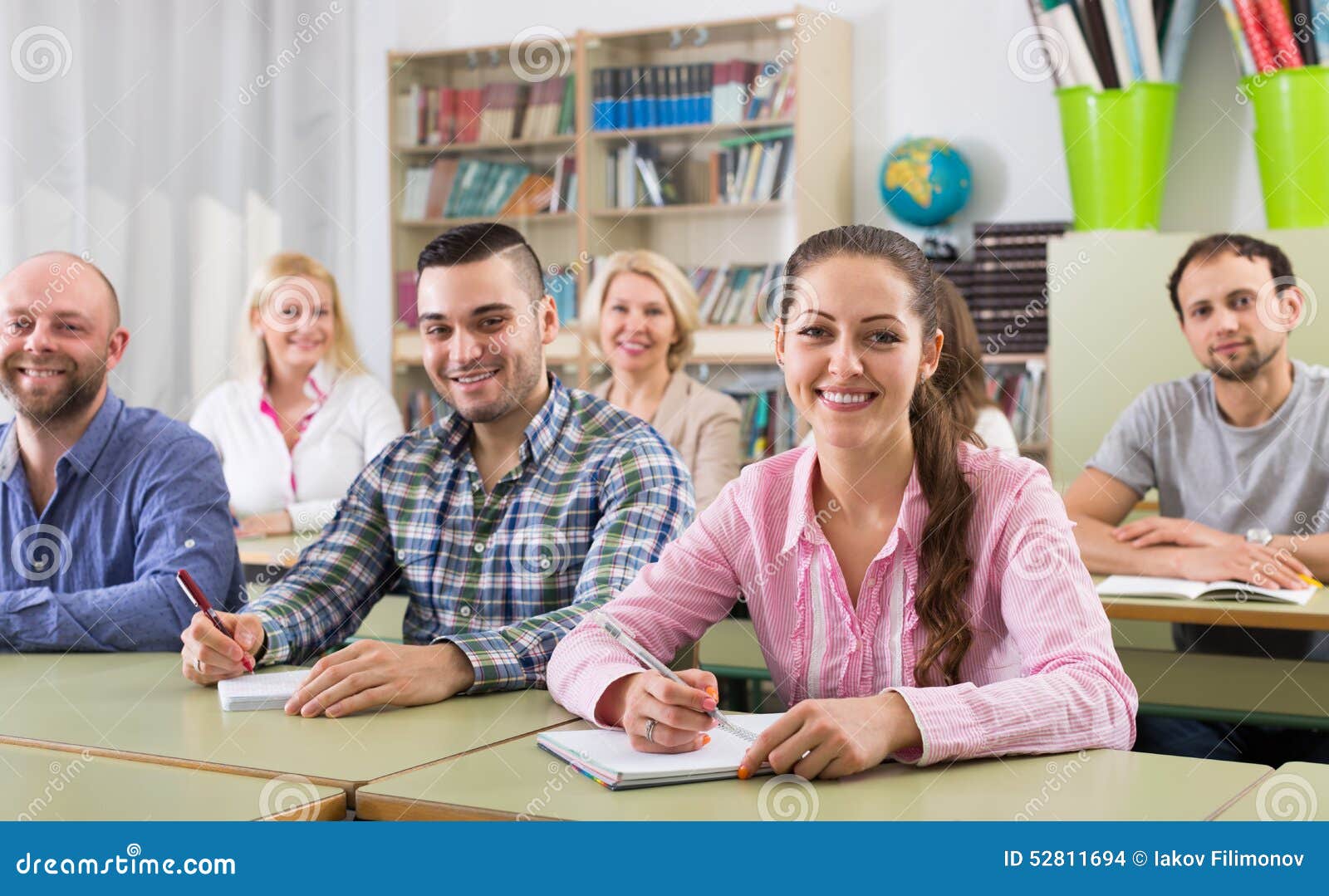 Adult Students Writing in Classroom Stock Photo - Image of desk ...