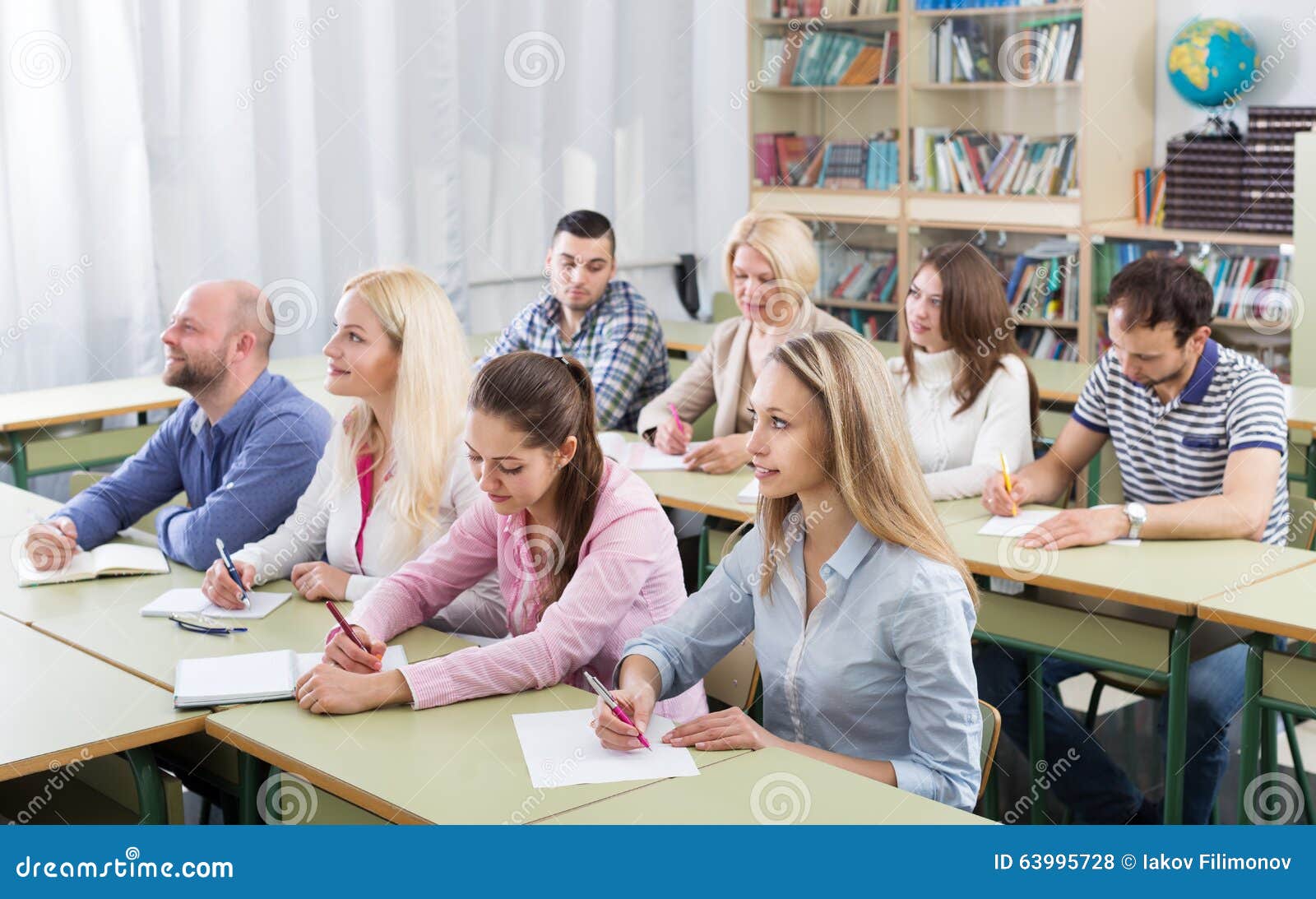 Adult Students Writing in Classroom Stock Photo - Image of professional ...