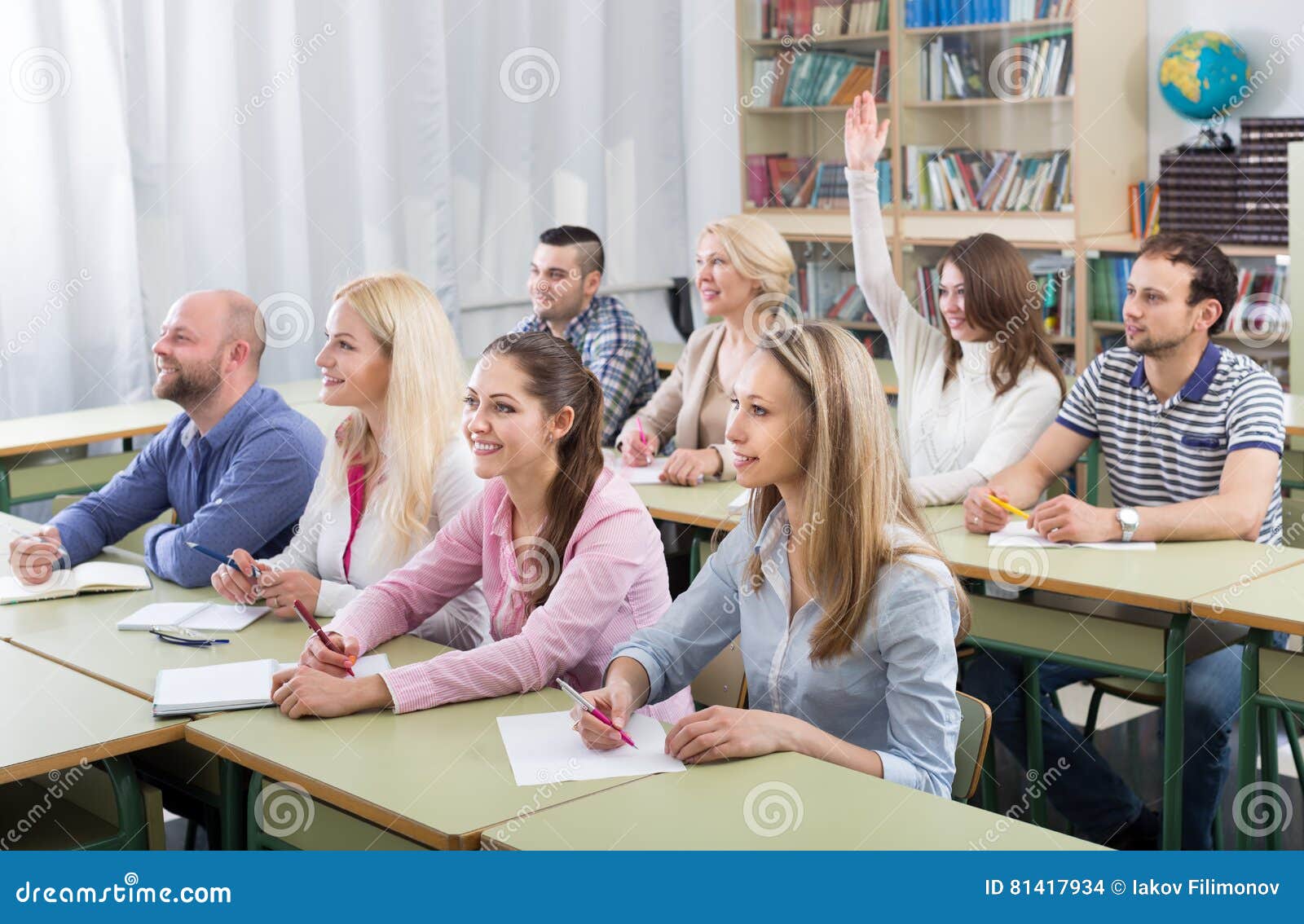 Adult Students Writing in Classroom Stock Photo - Image of adults ...