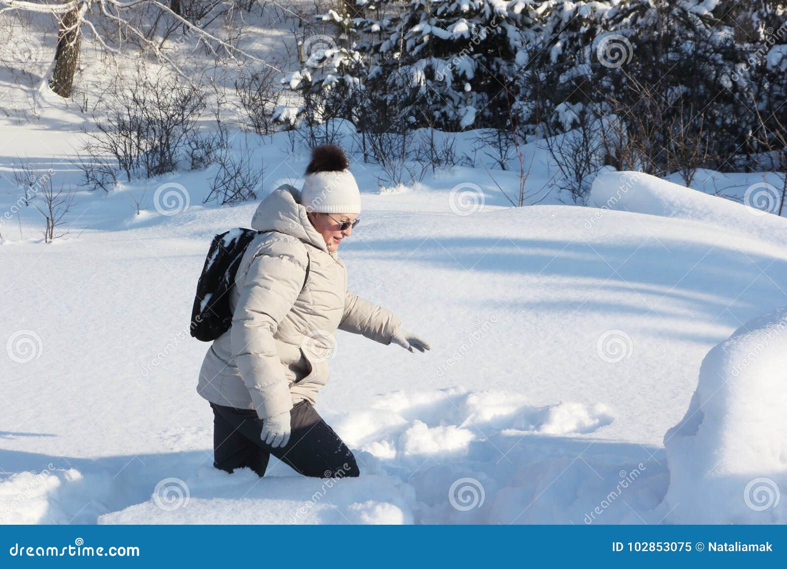 Adult Woman with a Backpack Going on Deep Snow in the Forest Stock ...