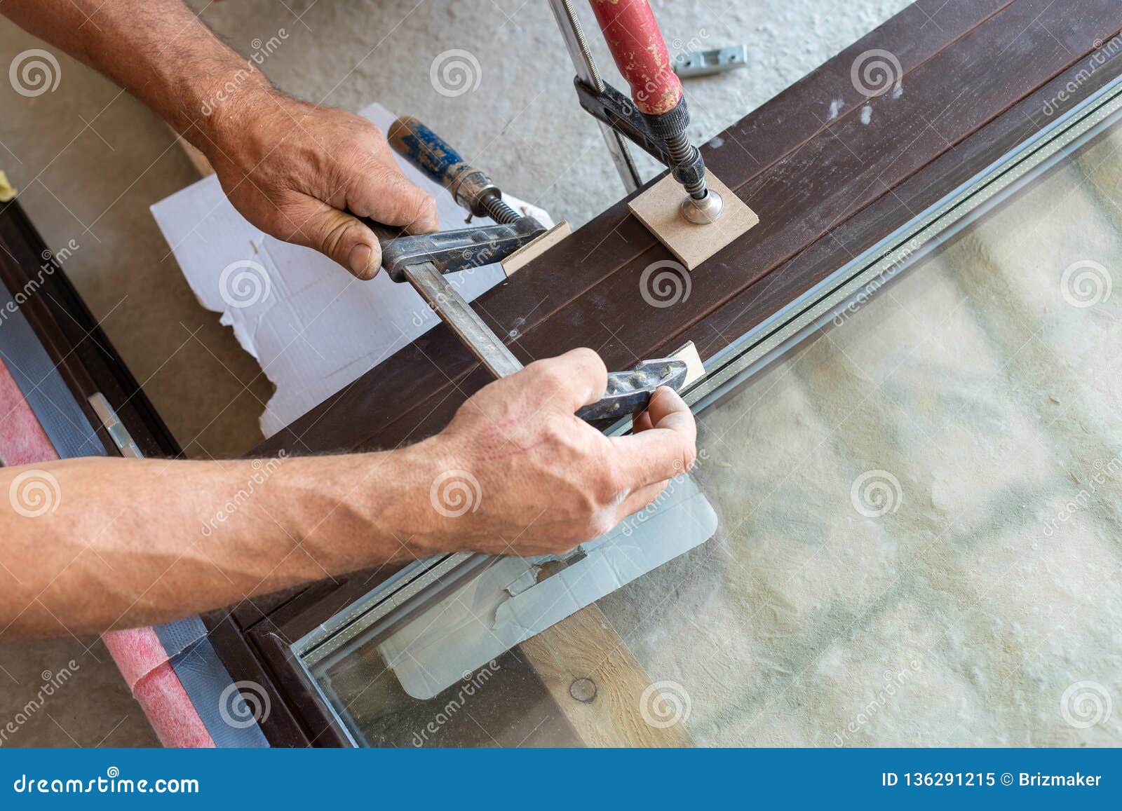 Man Holding C-clamp and Connect Elements of the Window Frame Stock ...