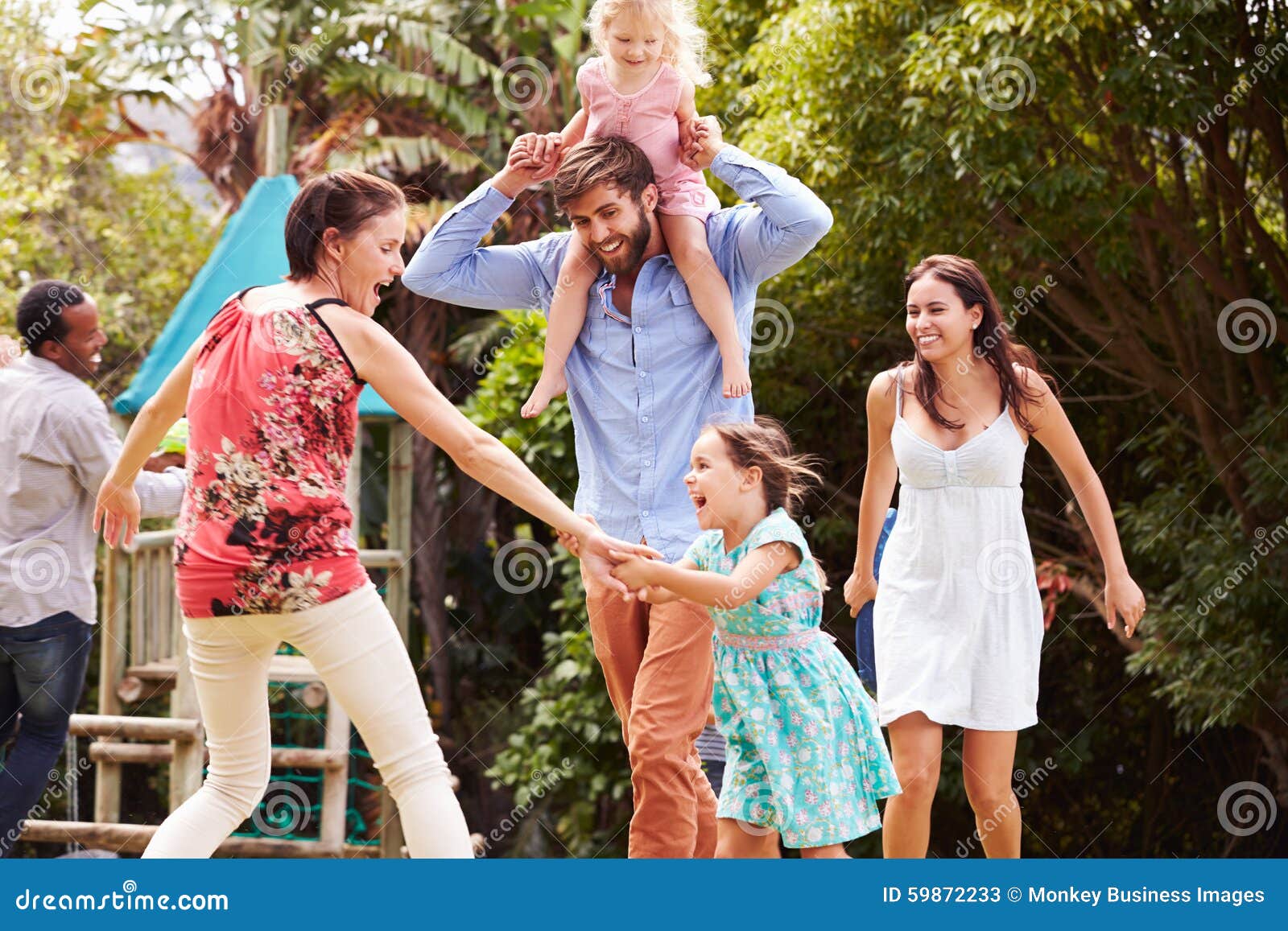 Adults And Kids Having Fun Playing In A Garden Stock Photo - Image ...