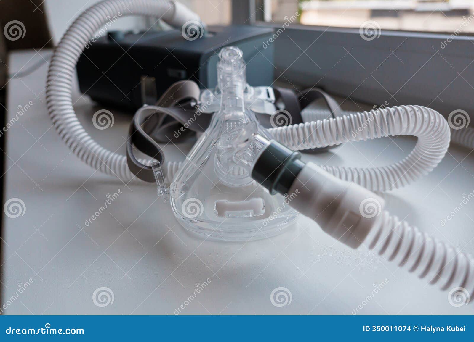 Advanced CPAP Machine with Attached Mask and Tubing on a Windowsill ...