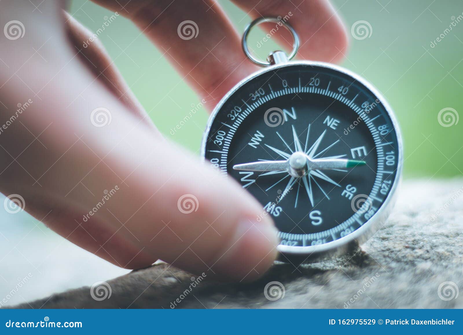 Adventure: Compass is Lying on the Floor, Showing the Direction Stock ...