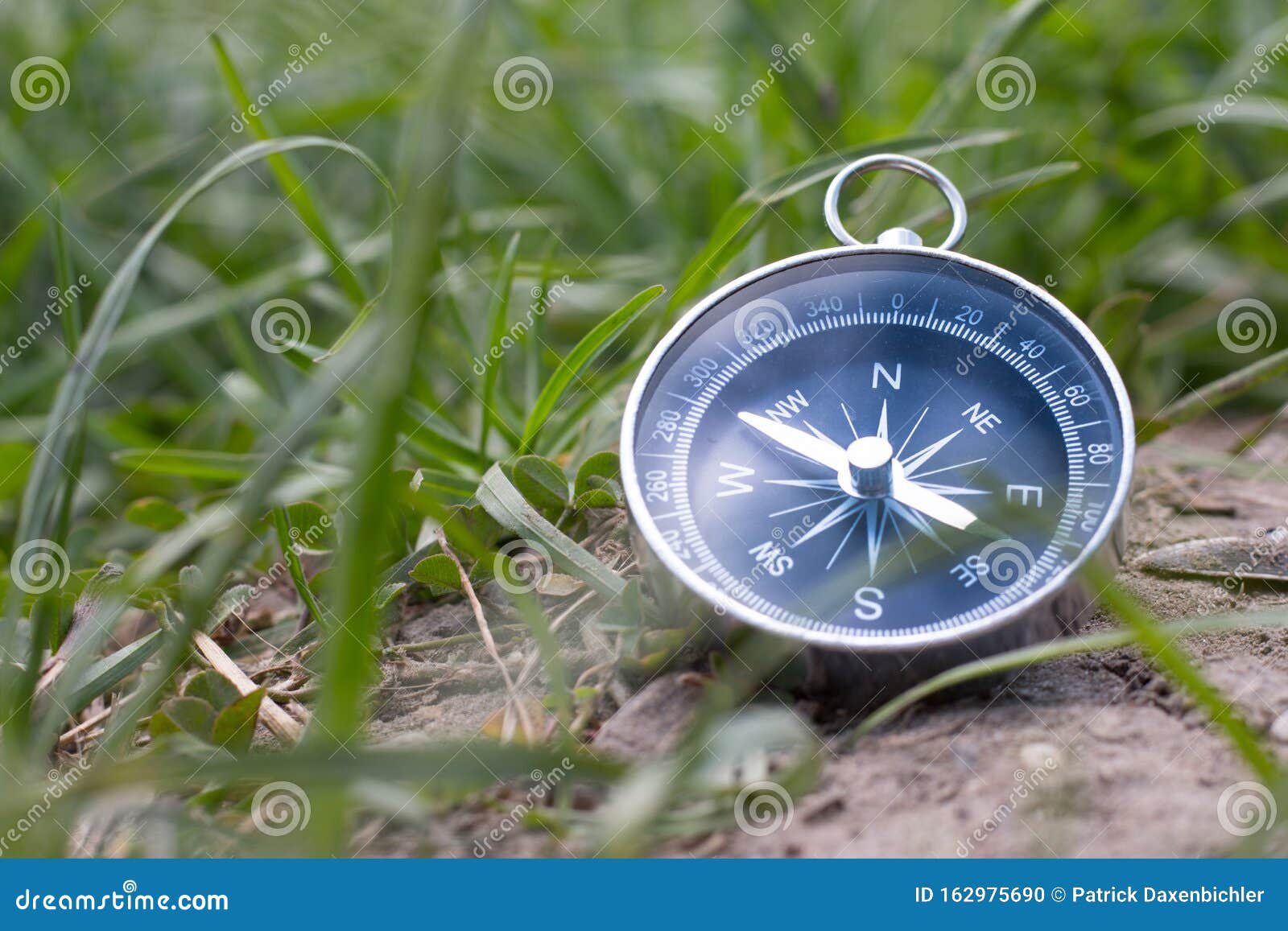 Adventure: Compass is Lying on the Floor, Showing the Direction Stock ...