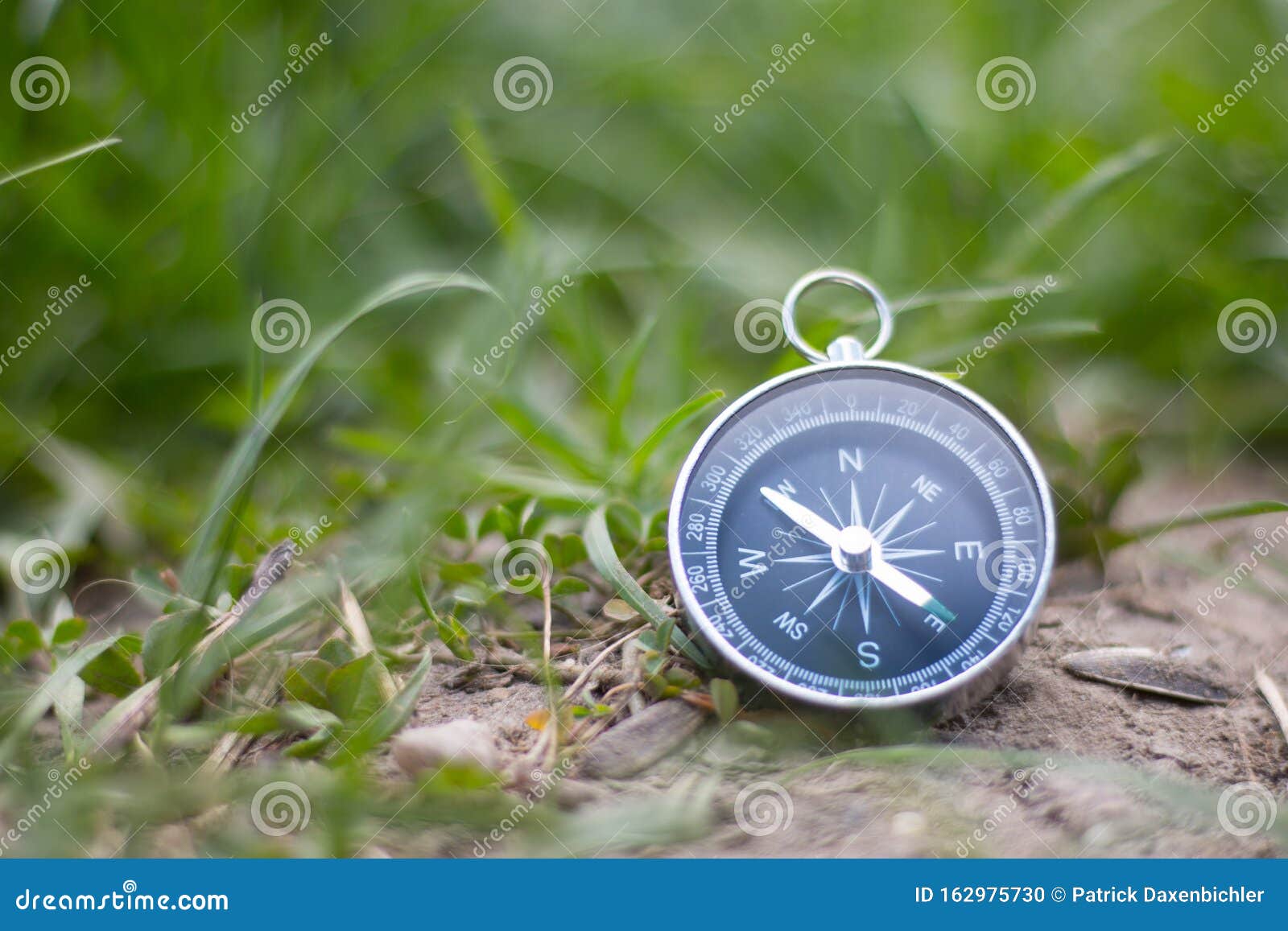 Adventure: Compass is Lying on the Floor, Showing the Direction Stock ...