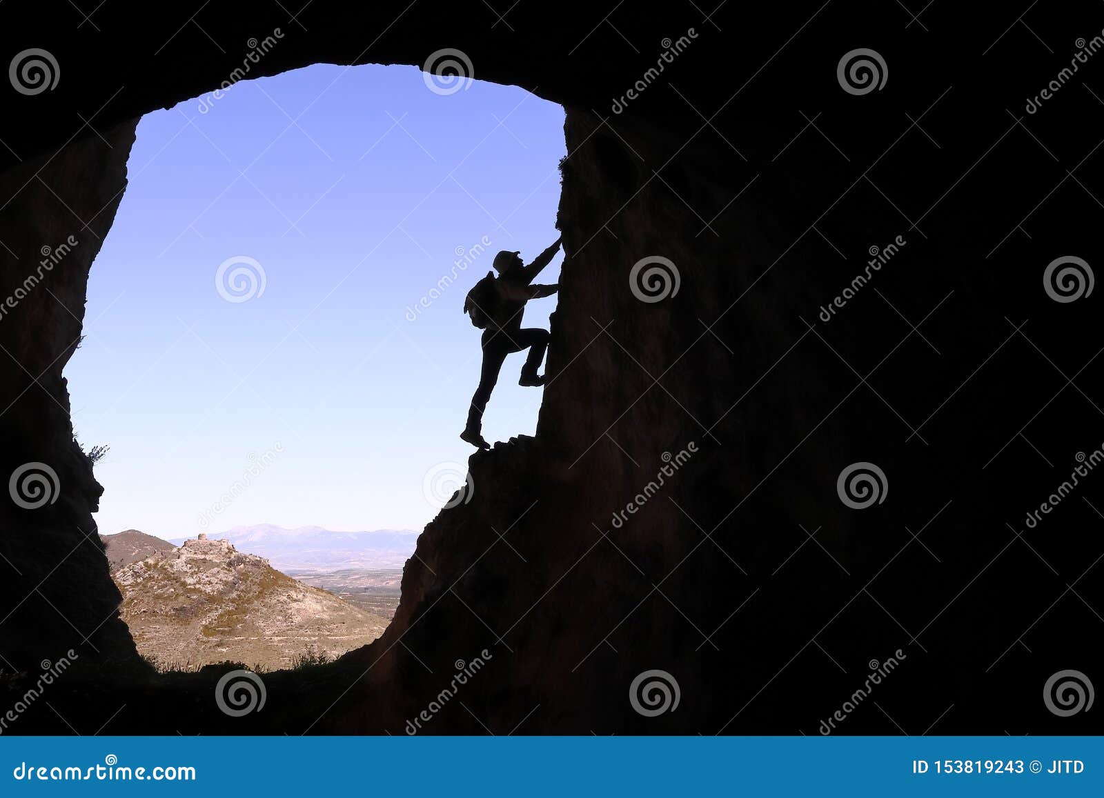 EXPLORER MAN with BACKPACK CLIMBING in a CAVE with a CASTLE at SIGHT ...