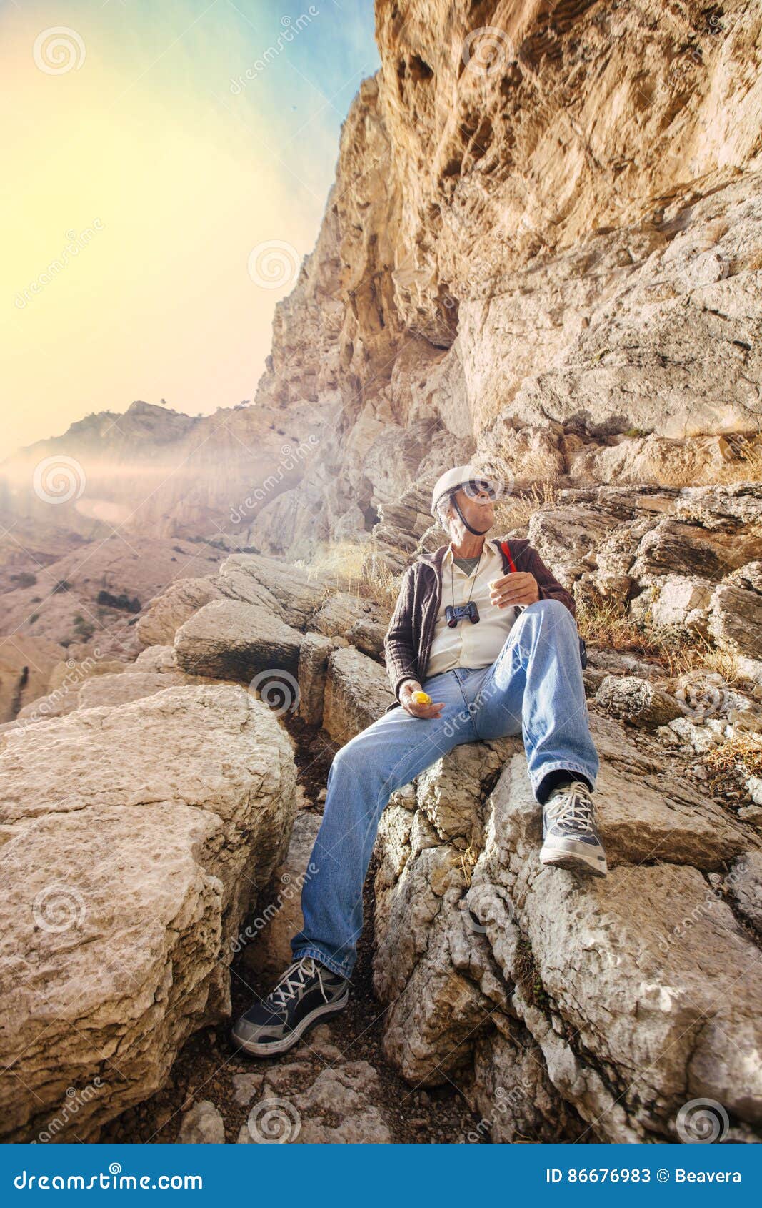 Adventurous Man with Helmet Having Some Rest on His Vacation Stock ...