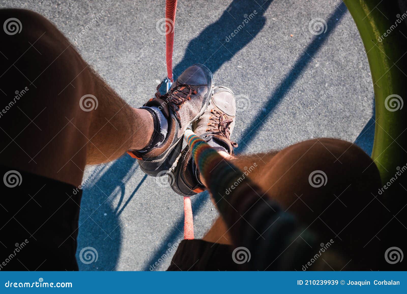 Adventurous Man Slides Down a Rope, Seen from His Boots Stock Image ...