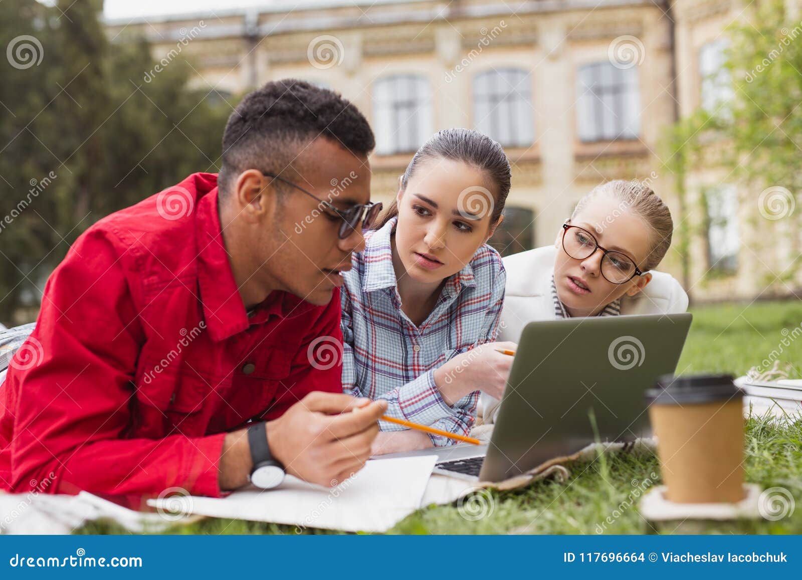 Two First Year Students Asking for Advice of Graduate Stock Photo ...