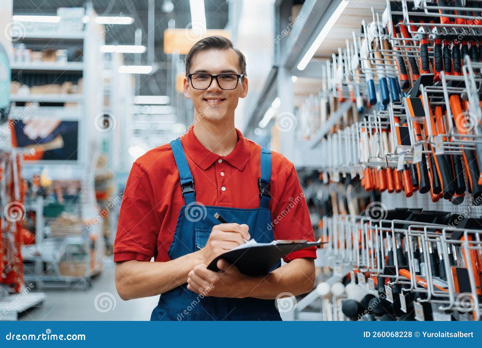 Adviser in a Hardware Store Making Notes about the Availability of ...