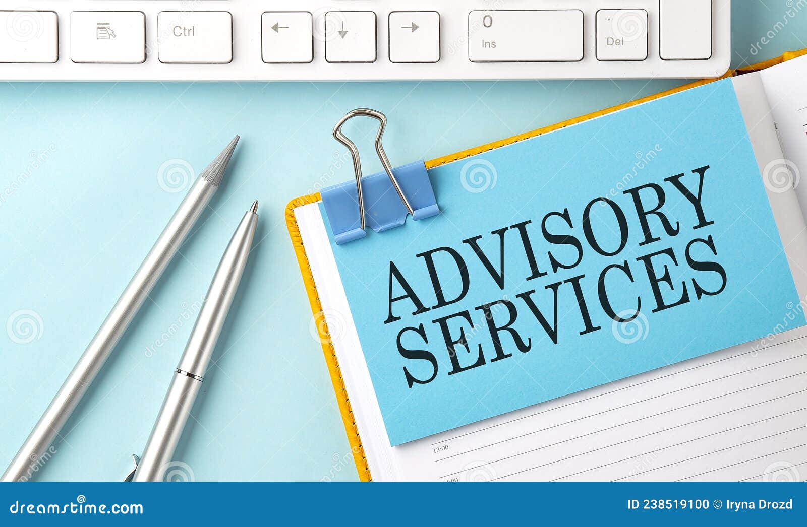 ADVISORY SERVICES Text on Sticker on the Blue Background with Pen and ...