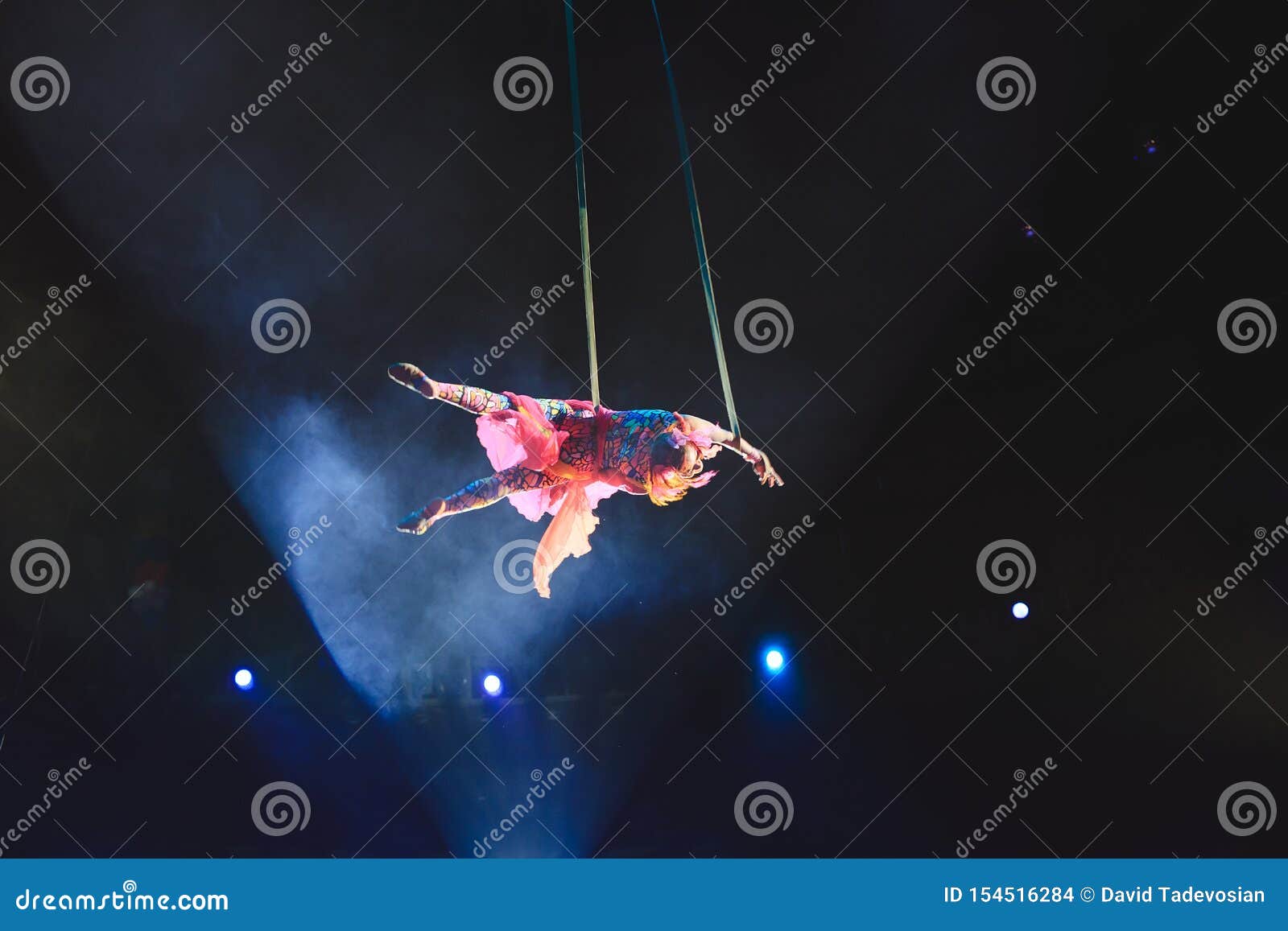 Aerial Acrobat in the Ring. a Young Girl Performs the Acrobatic ...