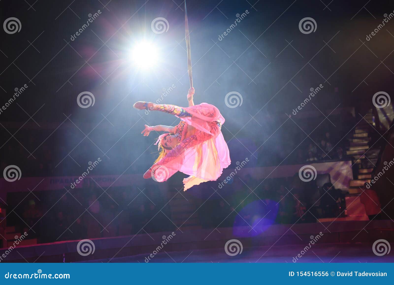 Aerial Acrobat in the Ring. a Young Girl Performs the Acrobatic ...