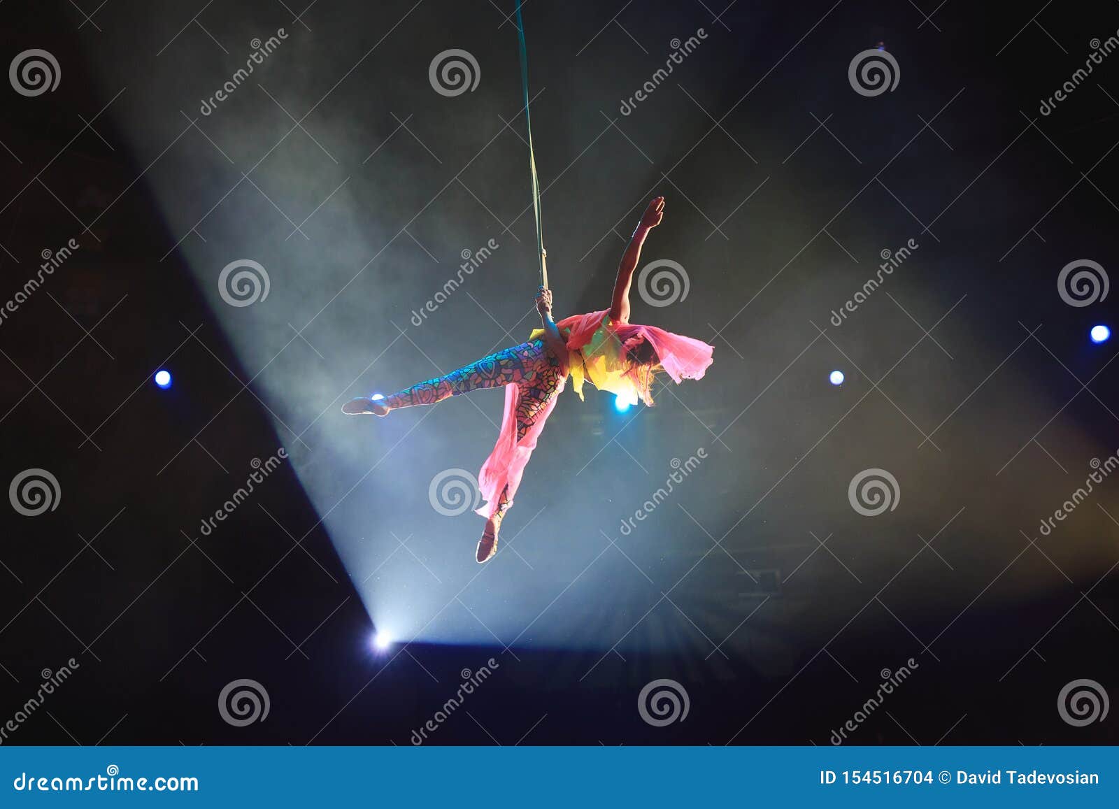 Aerial Acrobat in the Ring. a Young Girl Performs the Acrobatic ...