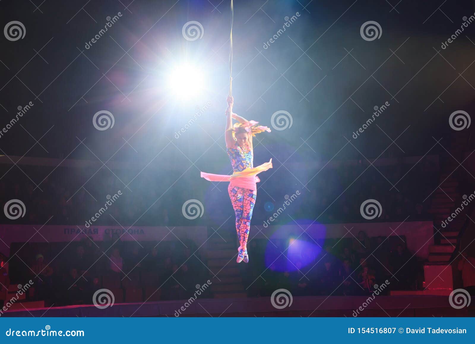 Aerial Acrobat in the Ring. a Young Girl Performs the Acrobatic ...