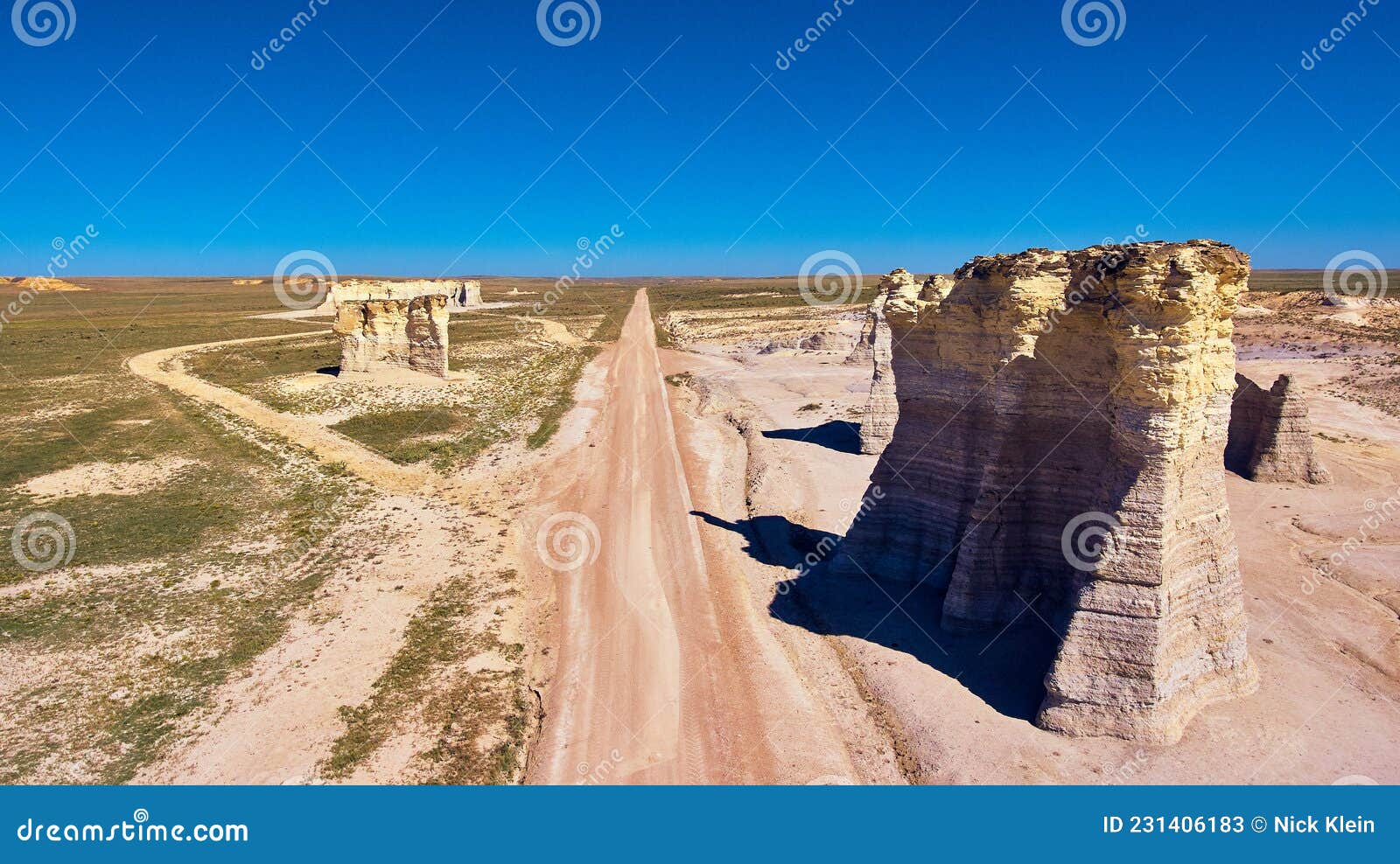 Aerial of Desert Road with Large White Rock Pillars Stock Image - Image ...