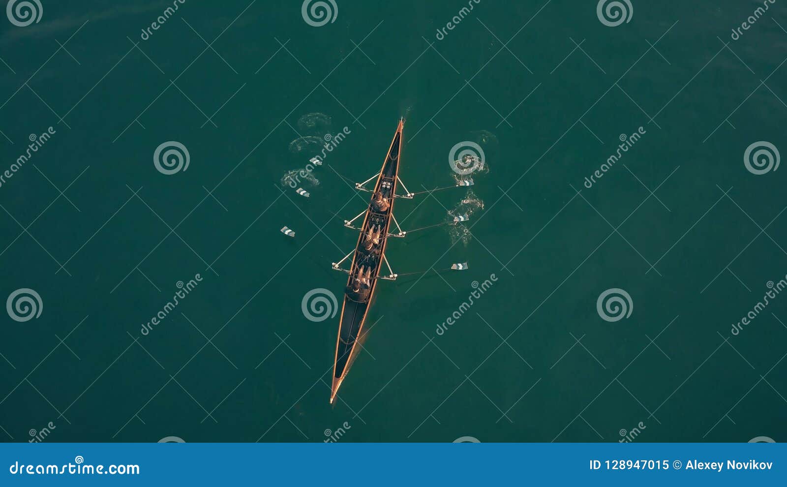 Aerial Down View of Three Unknown People Rowing in a Boat Stock Image ...