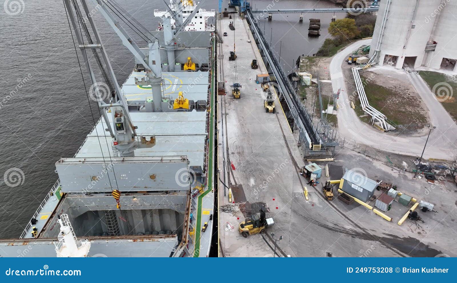 Aerial Drone View of a Cargo Ship Unloading Dockside Stock Footage ...