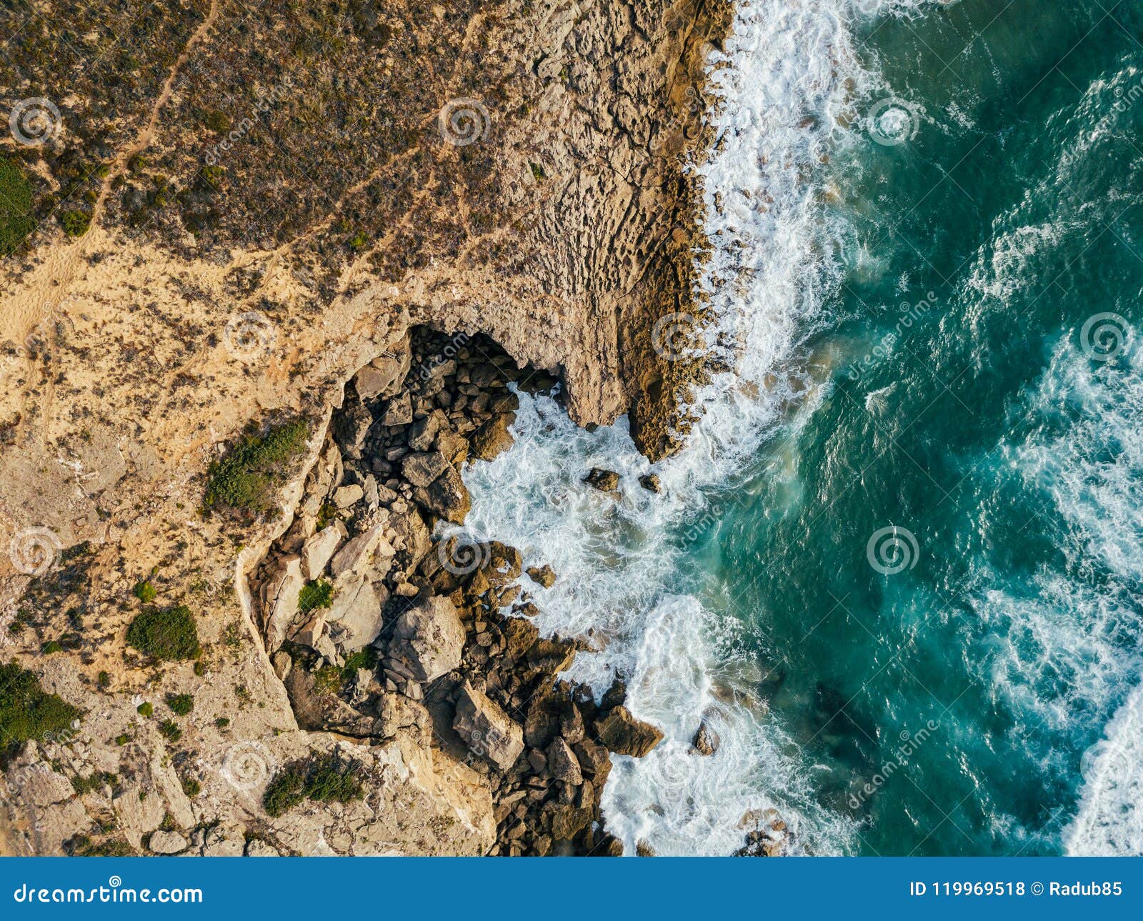 A Dramatic Ocean Cliffside With Waves Crashing Below. Picture Royalty ...