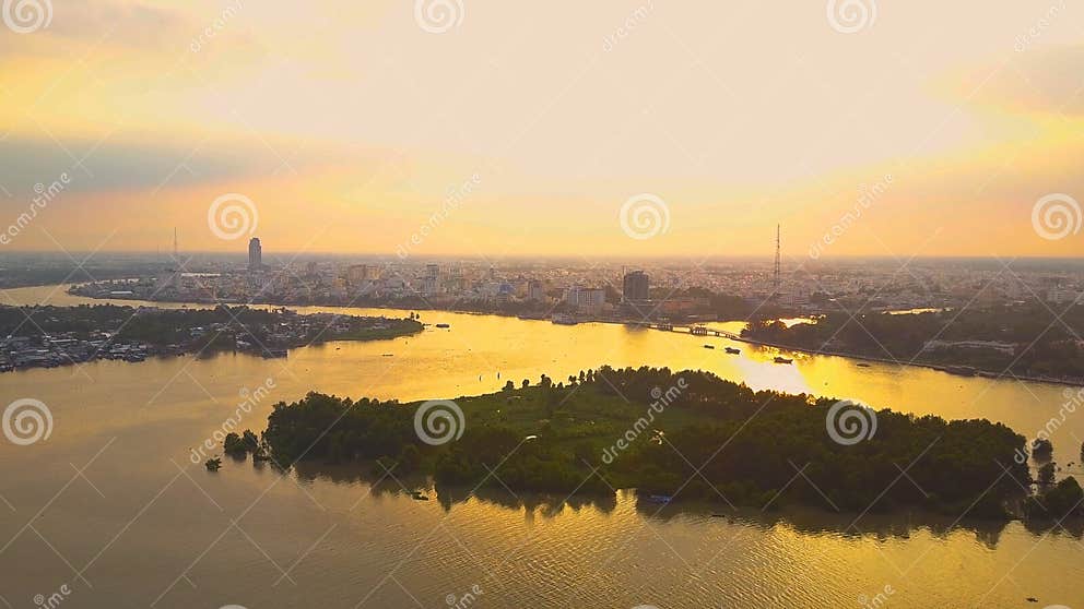 AERIAL: Flying Over the River and Towards Vietnamese City at Golden ... AERIAL: Flying Over the River and Towards Vietnamese City at Golden ...