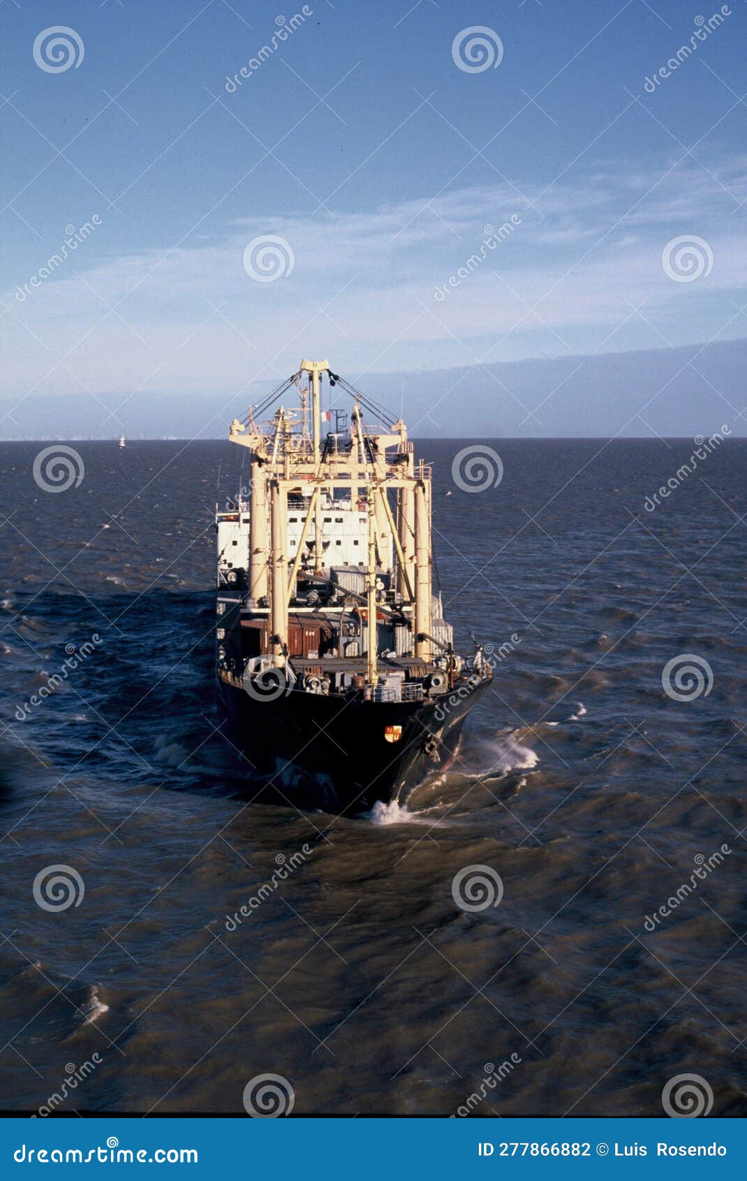 Aerial Front View of a Loaded Container Cargo Vessel Traveling Over ... Aerial Front View of a Loaded Container Cargo Vessel Traveling Over ...