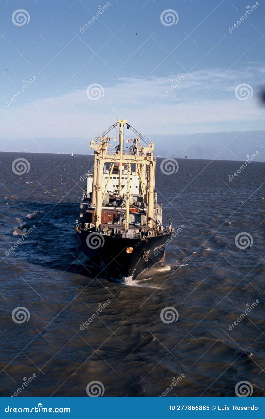 Aerial Front View of a Loaded Container Cargo Vessel Traveling Over ... Aerial Front View of a Loaded Container Cargo Vessel Traveling Over ...