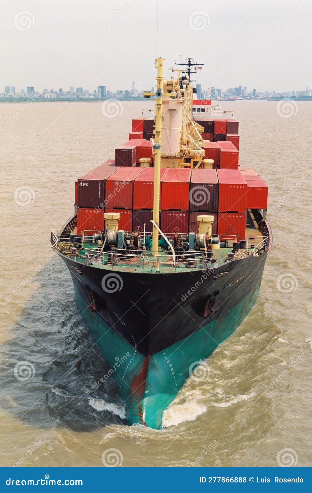 Aerial Front View of a Loaded Container Cargo Vessel Traveling Over ... Aerial Front View of a Loaded Container Cargo Vessel Traveling Over ...