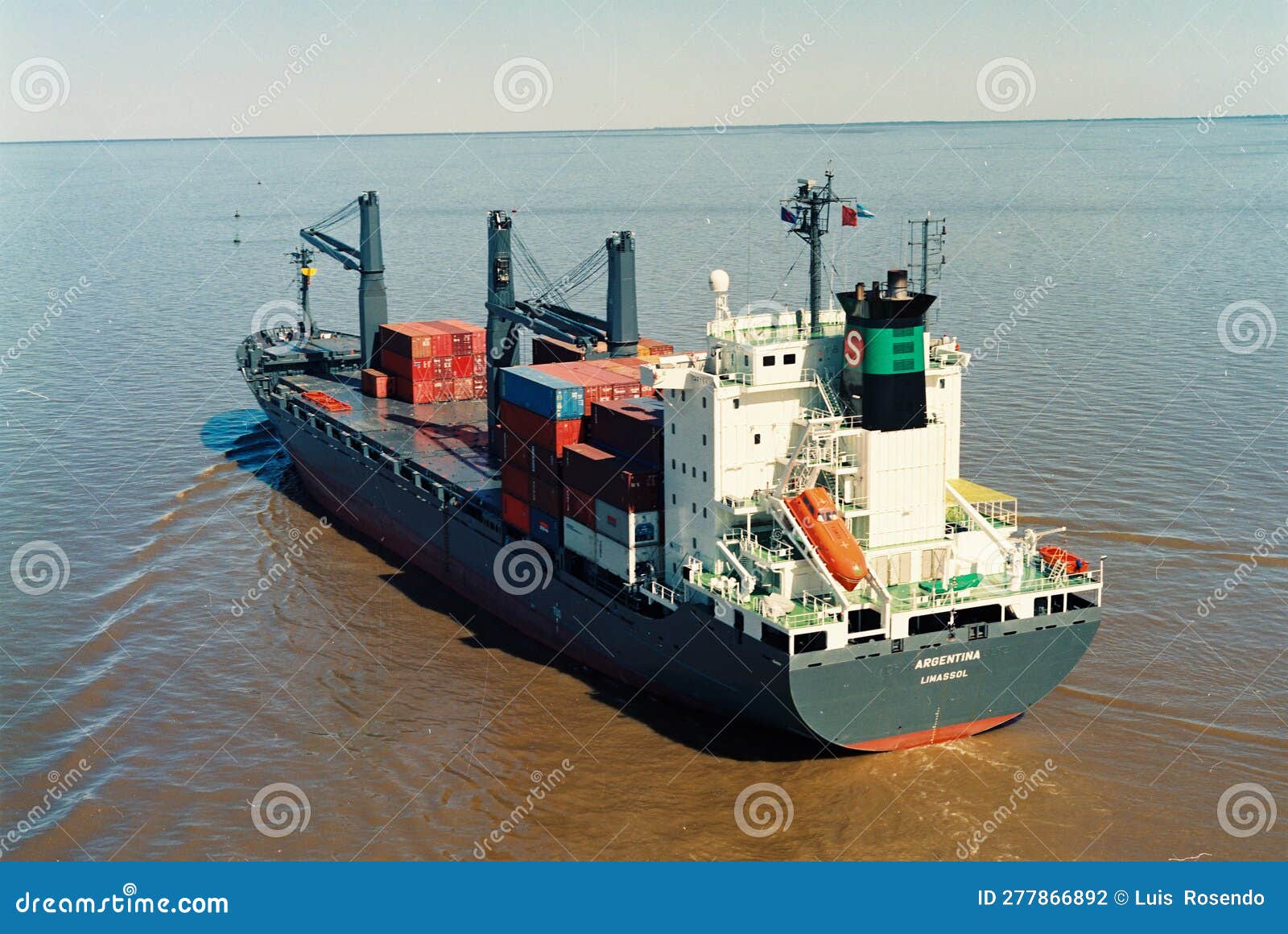 Aerial Front View of a Loaded Container Cargo Vessel Traveling Over ... Aerial Front View of a Loaded Container Cargo Vessel Traveling Over ...