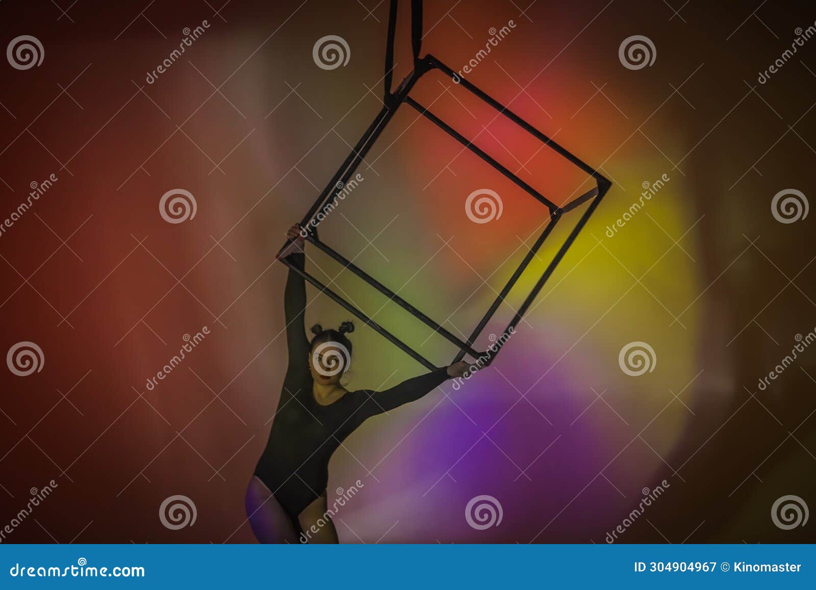 Aerial Gymnast in Black Leotard on Multicolored Background of Studio ...