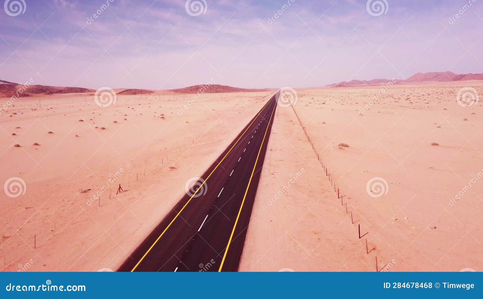 Aerial of a Long Highway Running Thorough the Desert Stock Footage ...