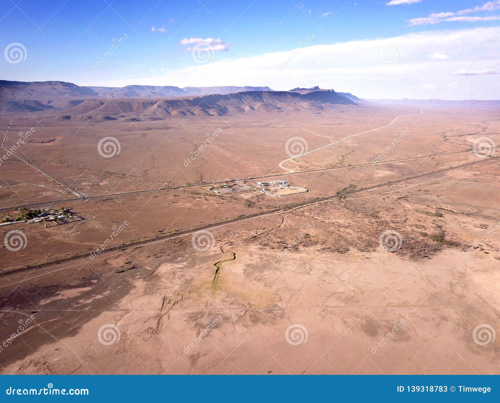 Aerial over a desert town stock image. Image of drone - 139318783