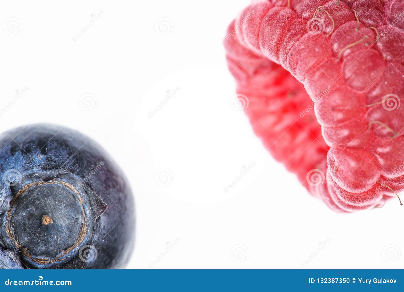 Aerial Red Raspberries and Dark Blue Blueberries on a Light Substrate ...