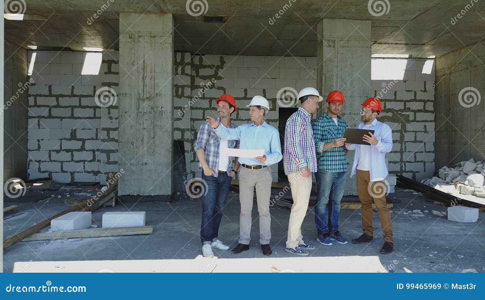 Aerial Shot of Builders Team on Construction Site Discussing Plan of ...