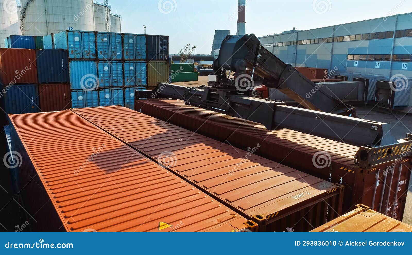 Aerial Shot of a Container Handler Carrying a Large Red Shipping Cargo ...