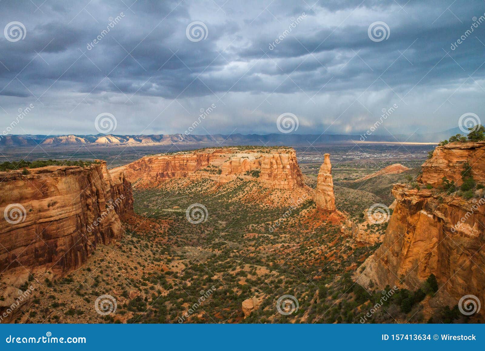 Aerial Shot of a Desert with Cliffs and Trees Under a Cloudy Sky Stock ...