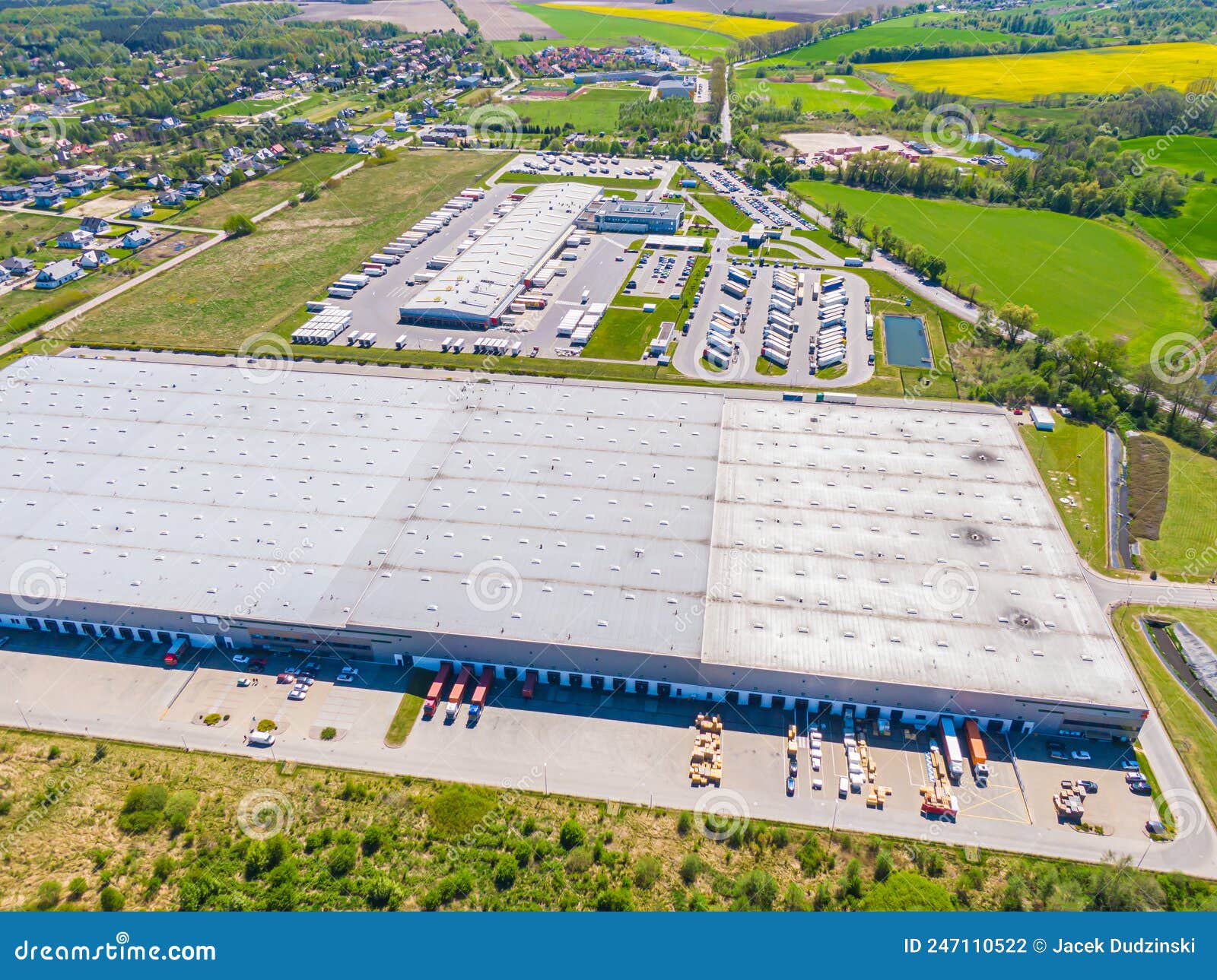 Aerial Shot of Industrial Loading Area Where Many Trucks are Unloading ...