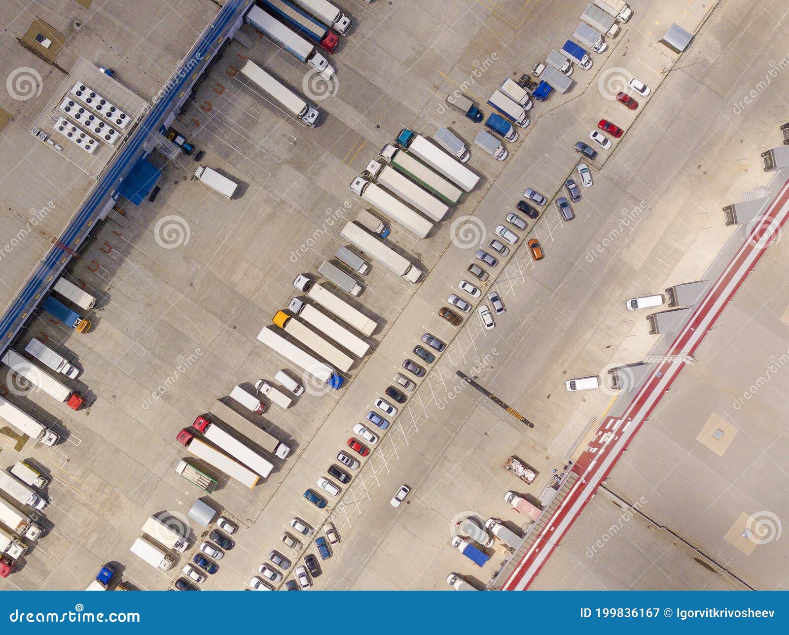 Aerial Shot of Industrial Loading Area Where Many Trucks are Unloading ...