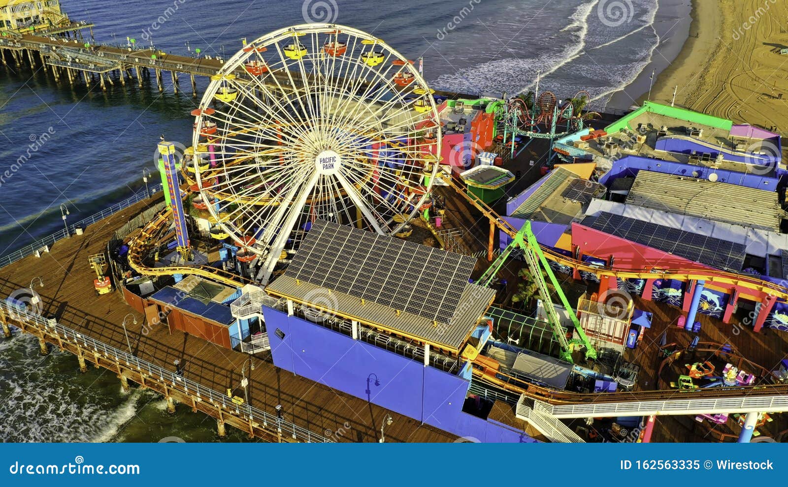 Aerial Shot of a Park with Different Kinds of Rides at the Beach ...