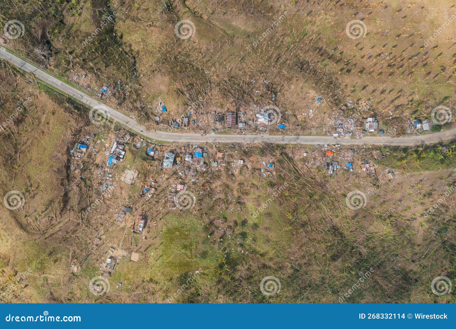 Aerial Shot of a Road in the Middle of Destroyed Buildings on Dry ...