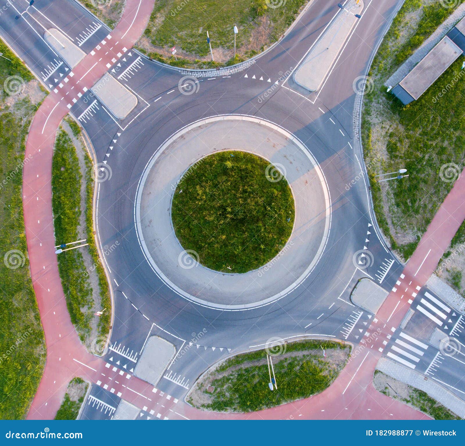Aerial Shot of a Roundabout Surrounded by Greenery Under the Sunlight ...