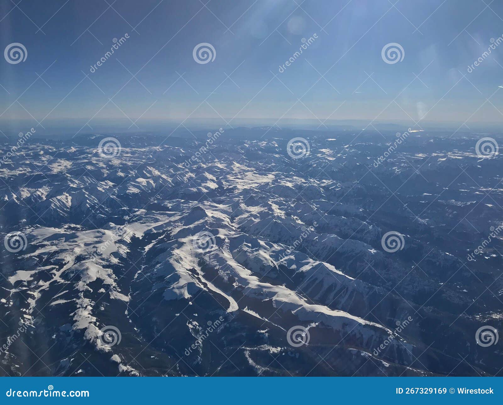 Aerial Shot of a Snow-covered Mountain Range Stock Image - Image of ...