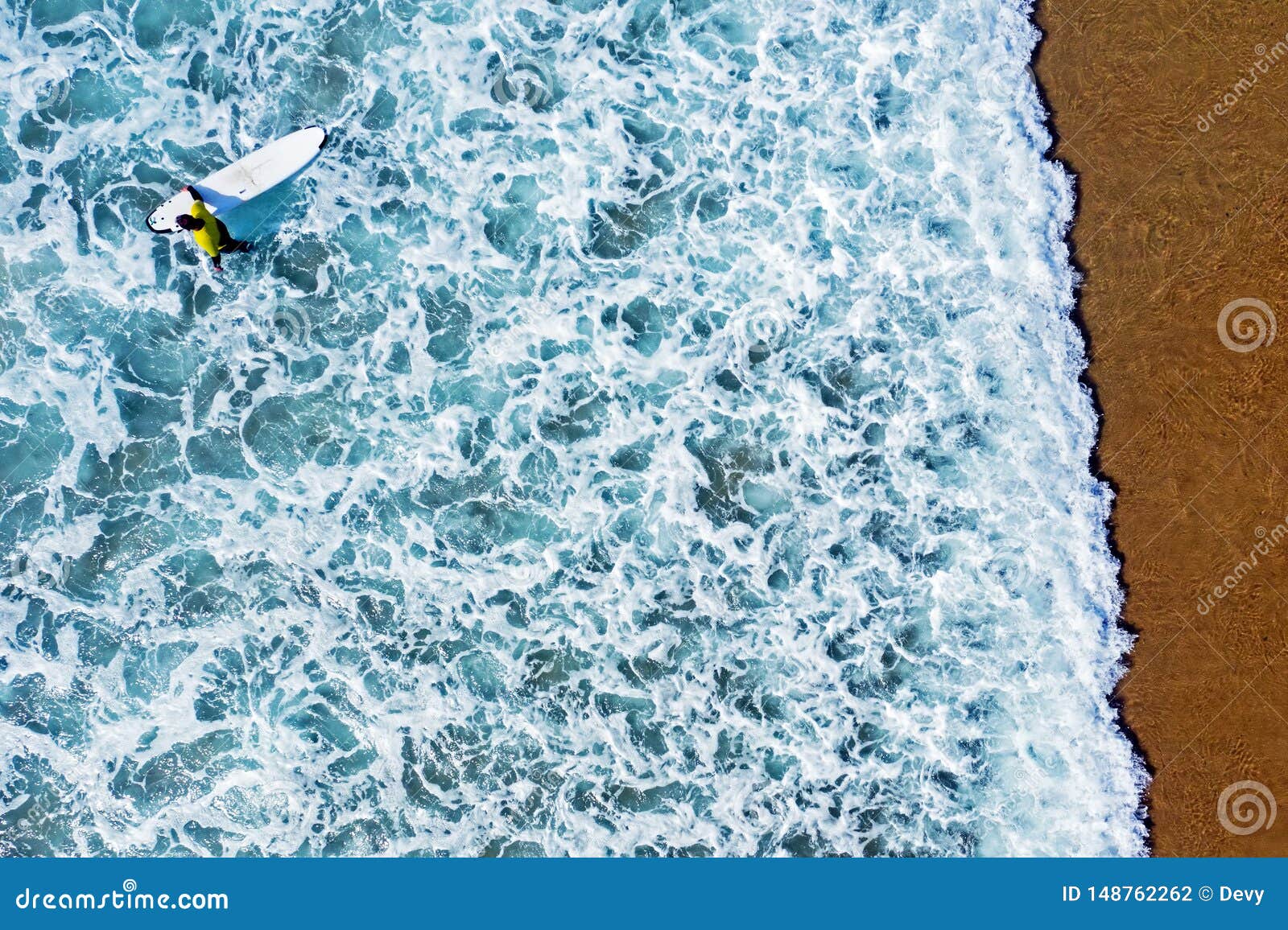 Aerial Shot from a Surfer Going To Surf in the Ocean Stock Photo ...