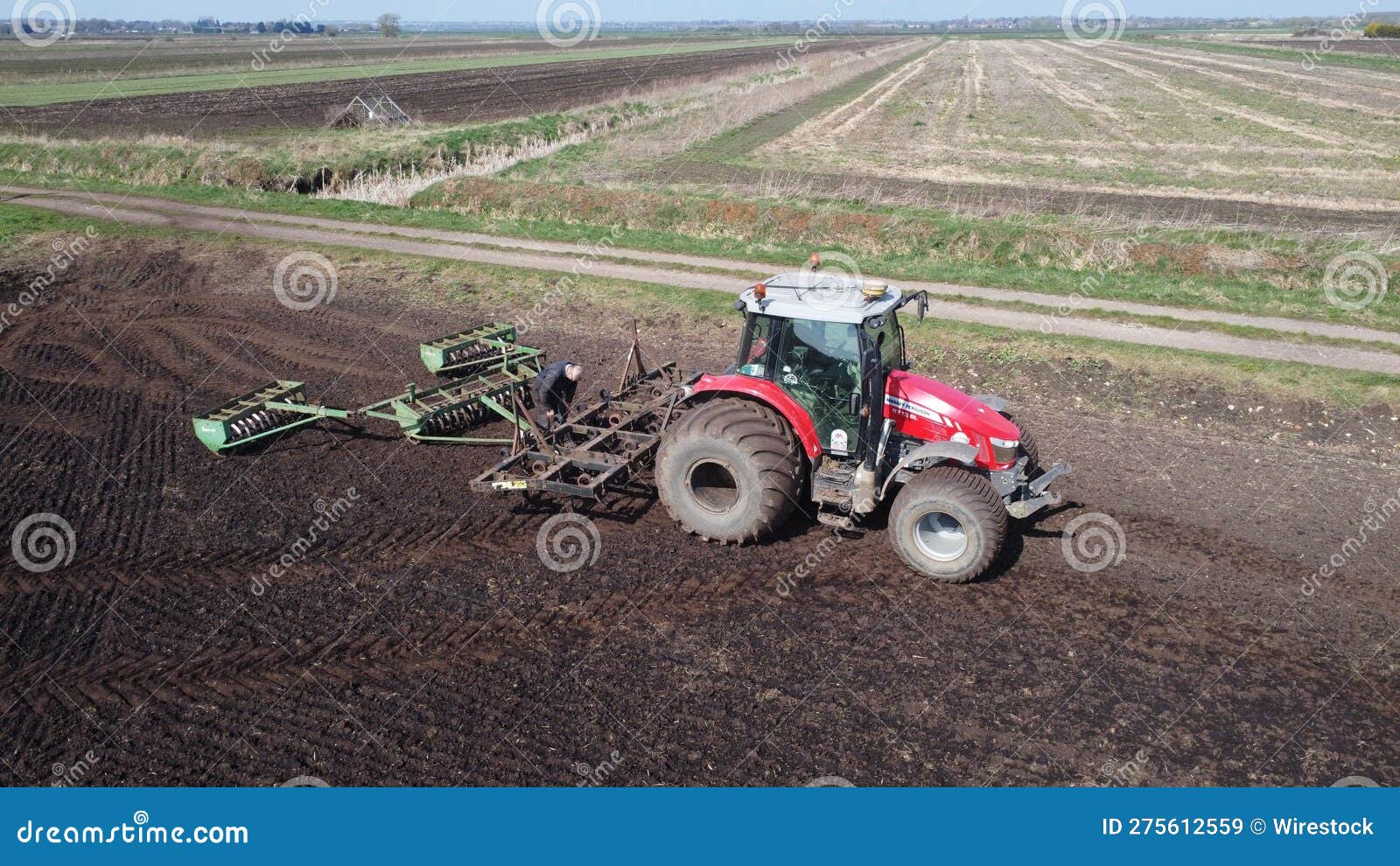 Aerial Shot of a Tractor Working in a Rural Field. Editorial Stock ...