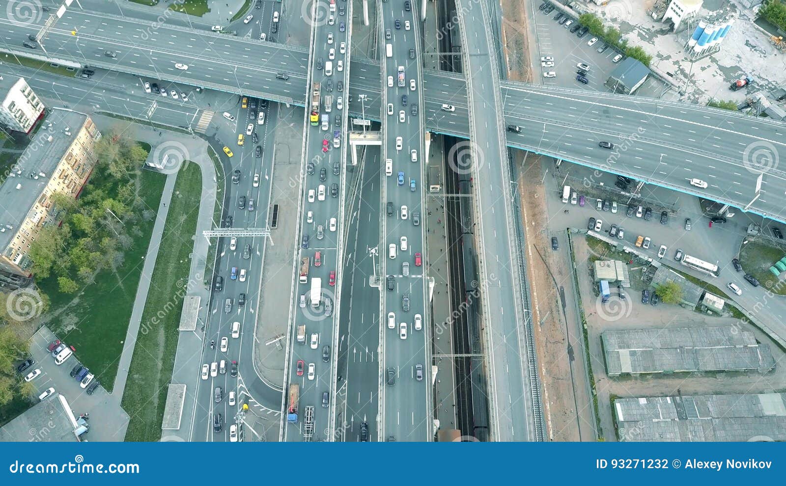 Aerial Shot of Traffic Jam on a Highway and Moving Train in the Rush ...