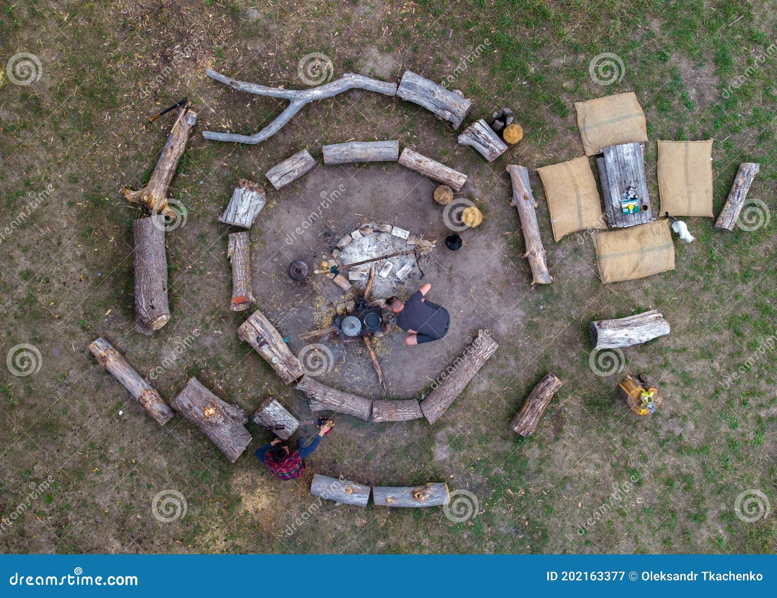 Aerial Top Down View of Big Campfire with Circles of Logs. Bonefire for ...